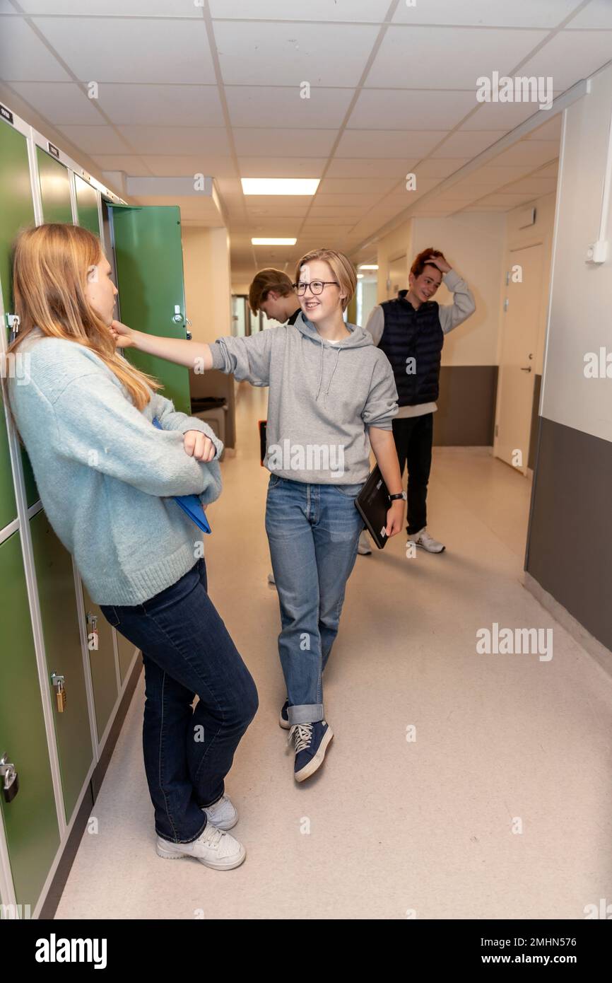 Teenage kids in school locker room Stock Photo - Alamy