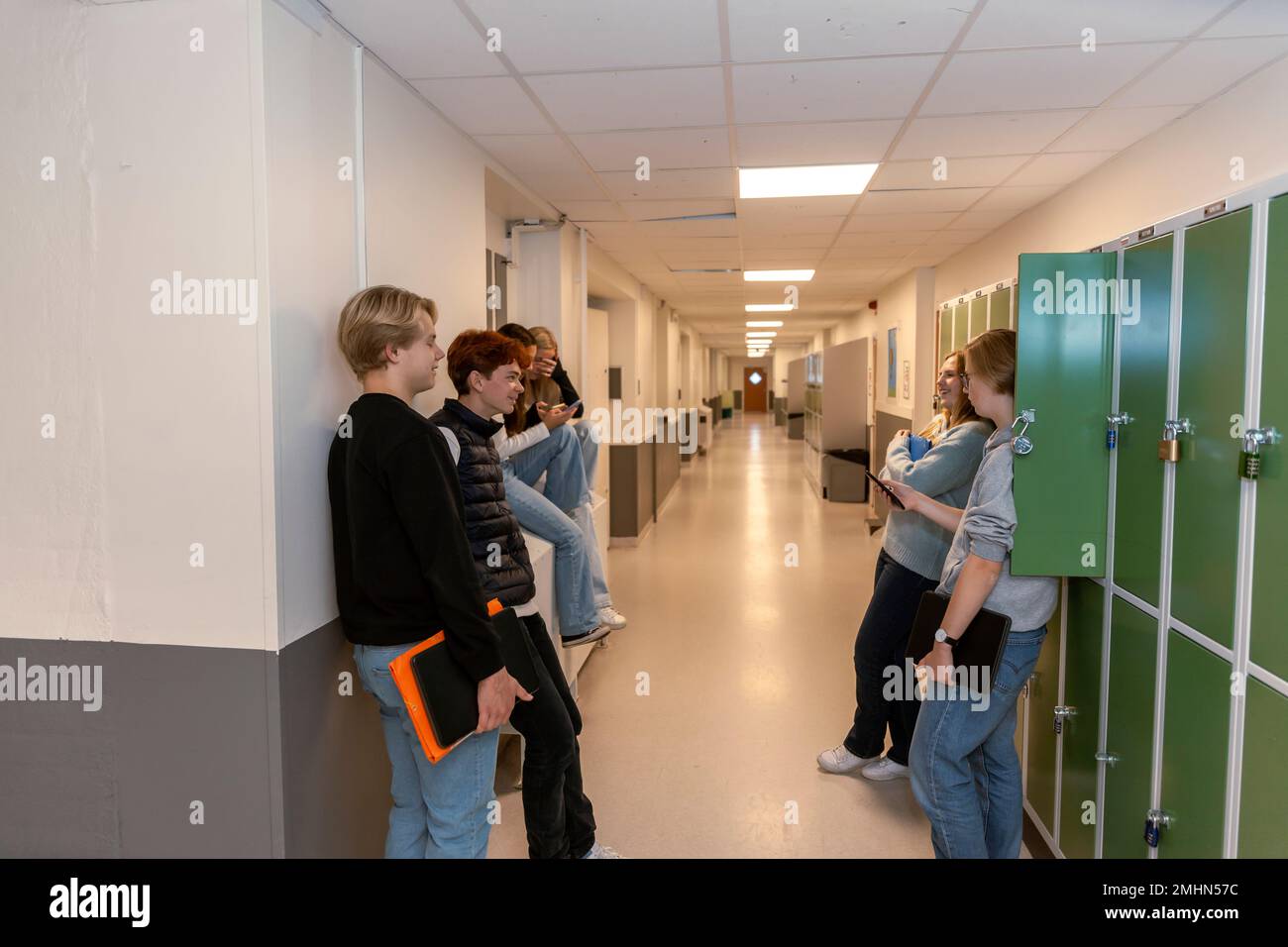 Teenage kids in school locker room Stock Photo - Alamy