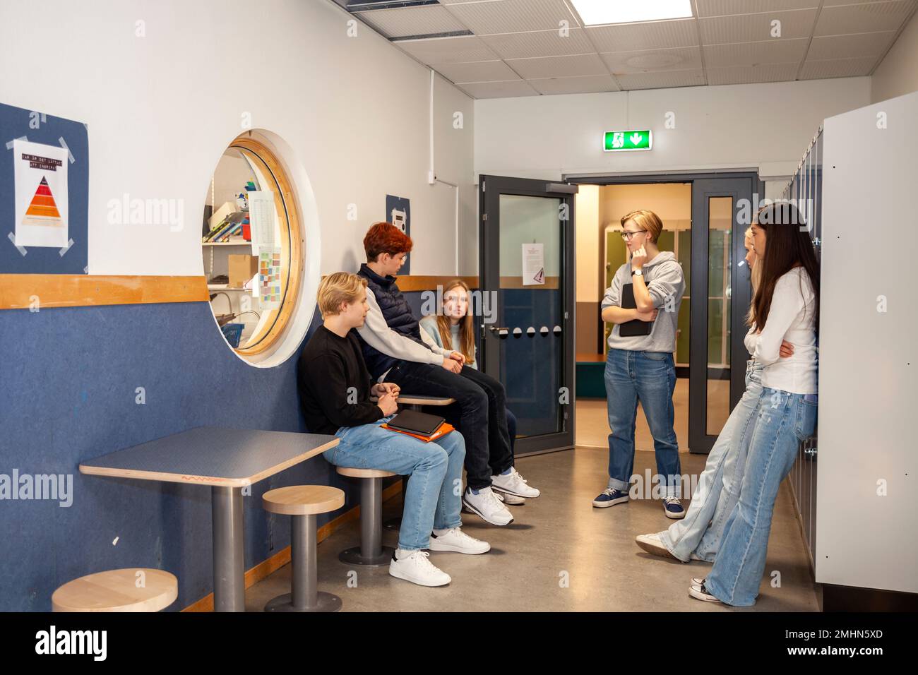 Teenage kids in school locker room Stock Photo - Alamy