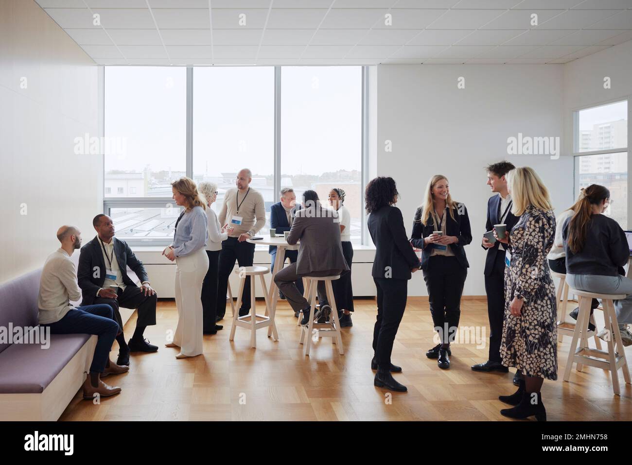 Business people talking together Stock Photo - Alamy