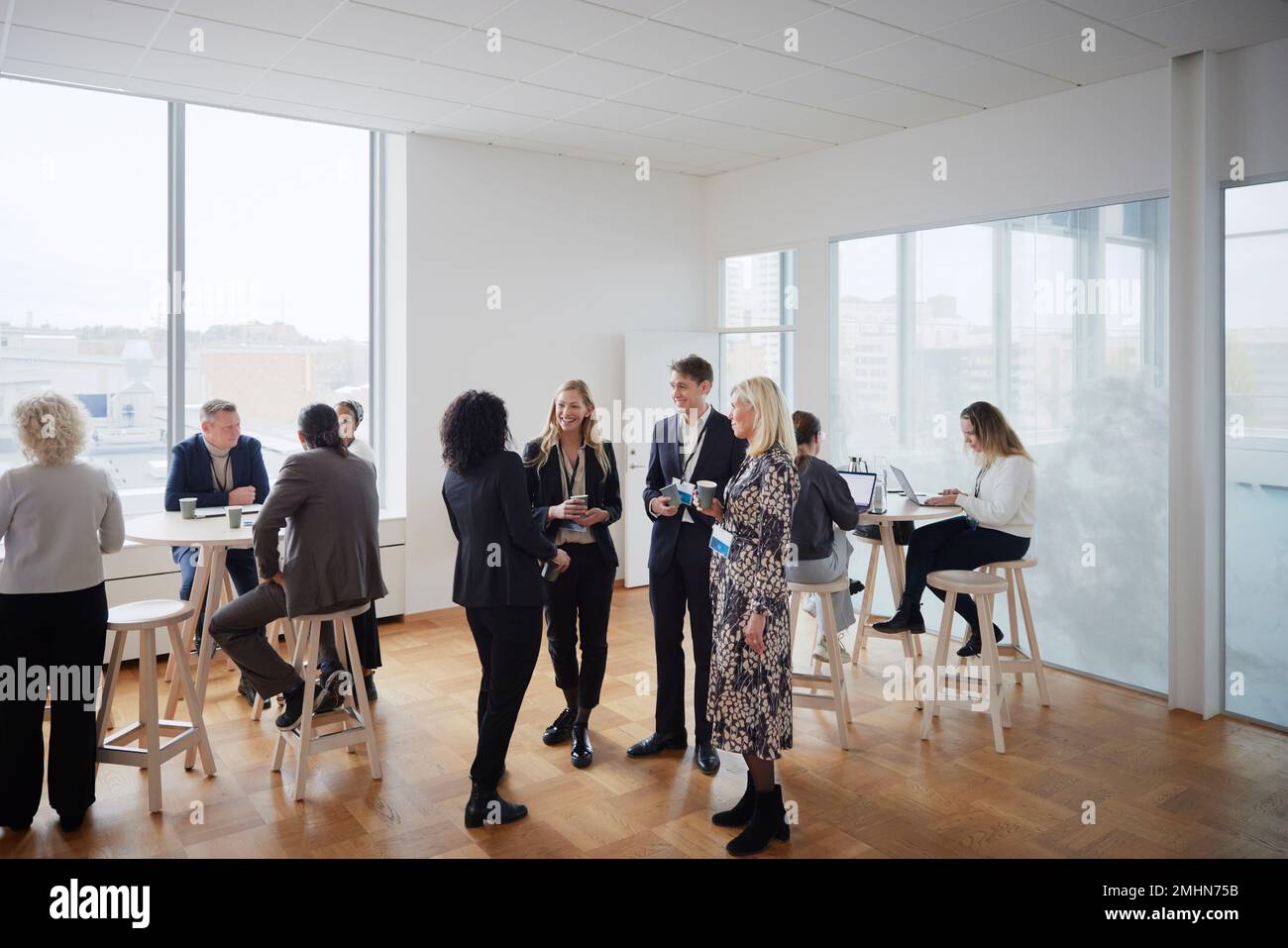 Business people talking together Stock Photo - Alamy
