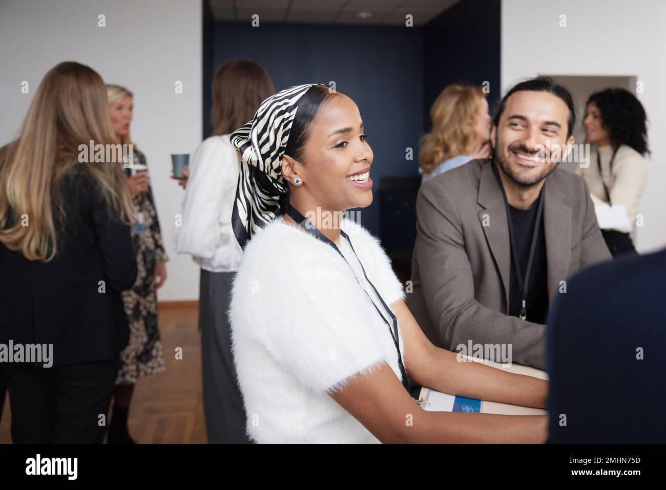 Smiling business people talking Stock Photo - Alamy