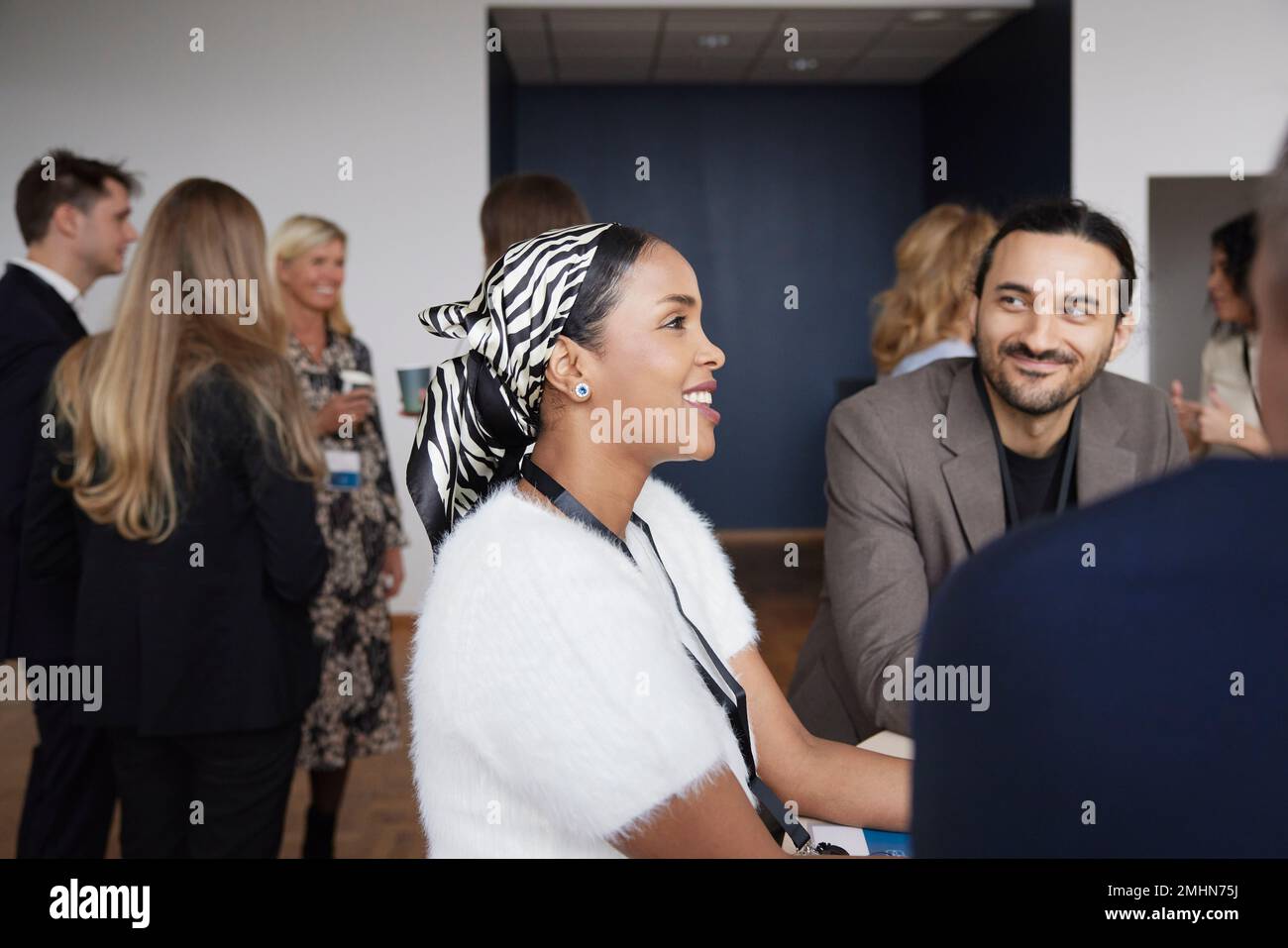 Smiling business people talking Stock Photo - Alamy
