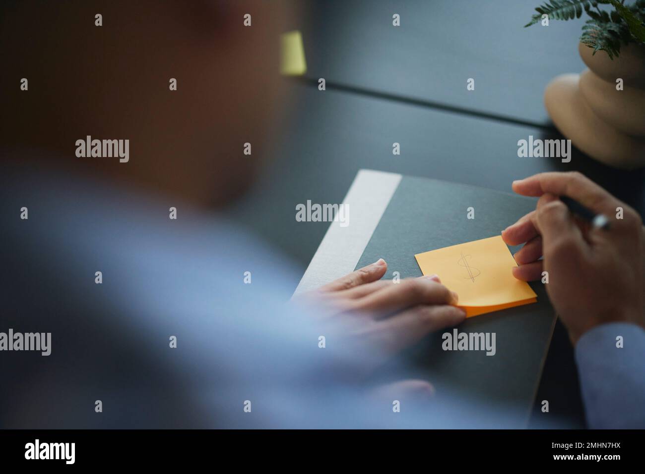 Man taking notes during meeting Stock Photo - Alamy