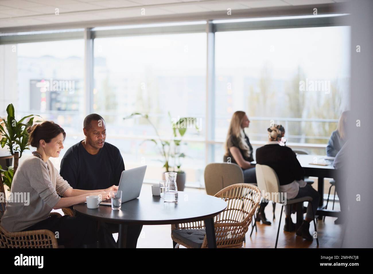 People talking in cafeteria Stock Photo - Alamy