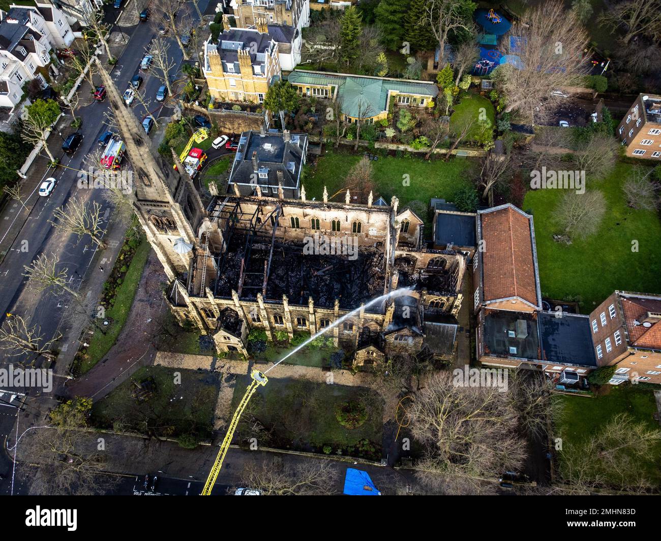 London, UK. Jan 27th 2023. Aerial view of burnt church as firefighters ...