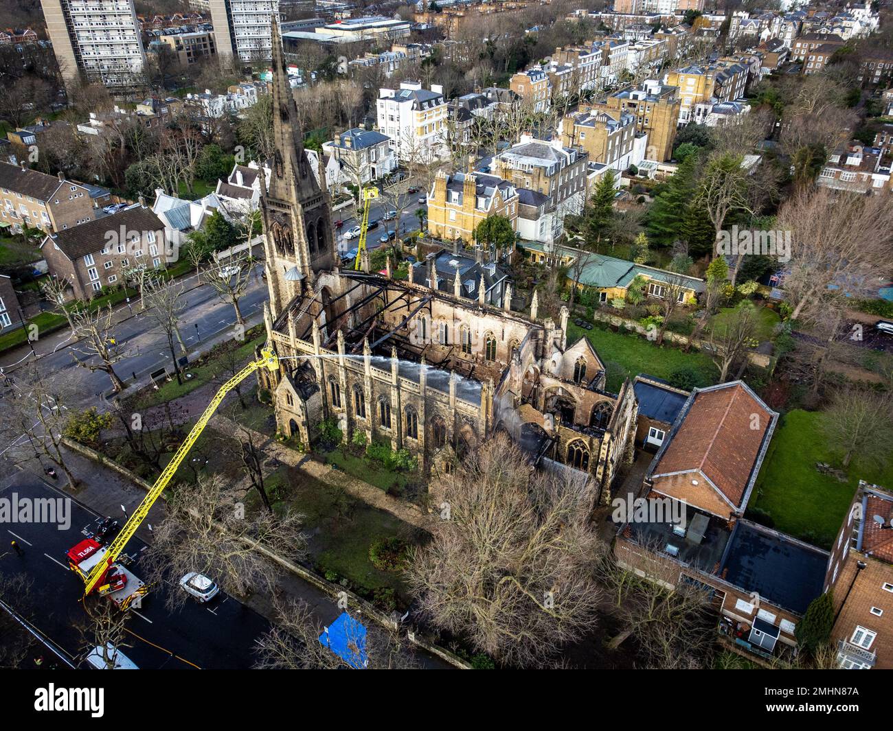 London, UK. Jan 27th 2023. Aerial view of burnt church as firefighters ...