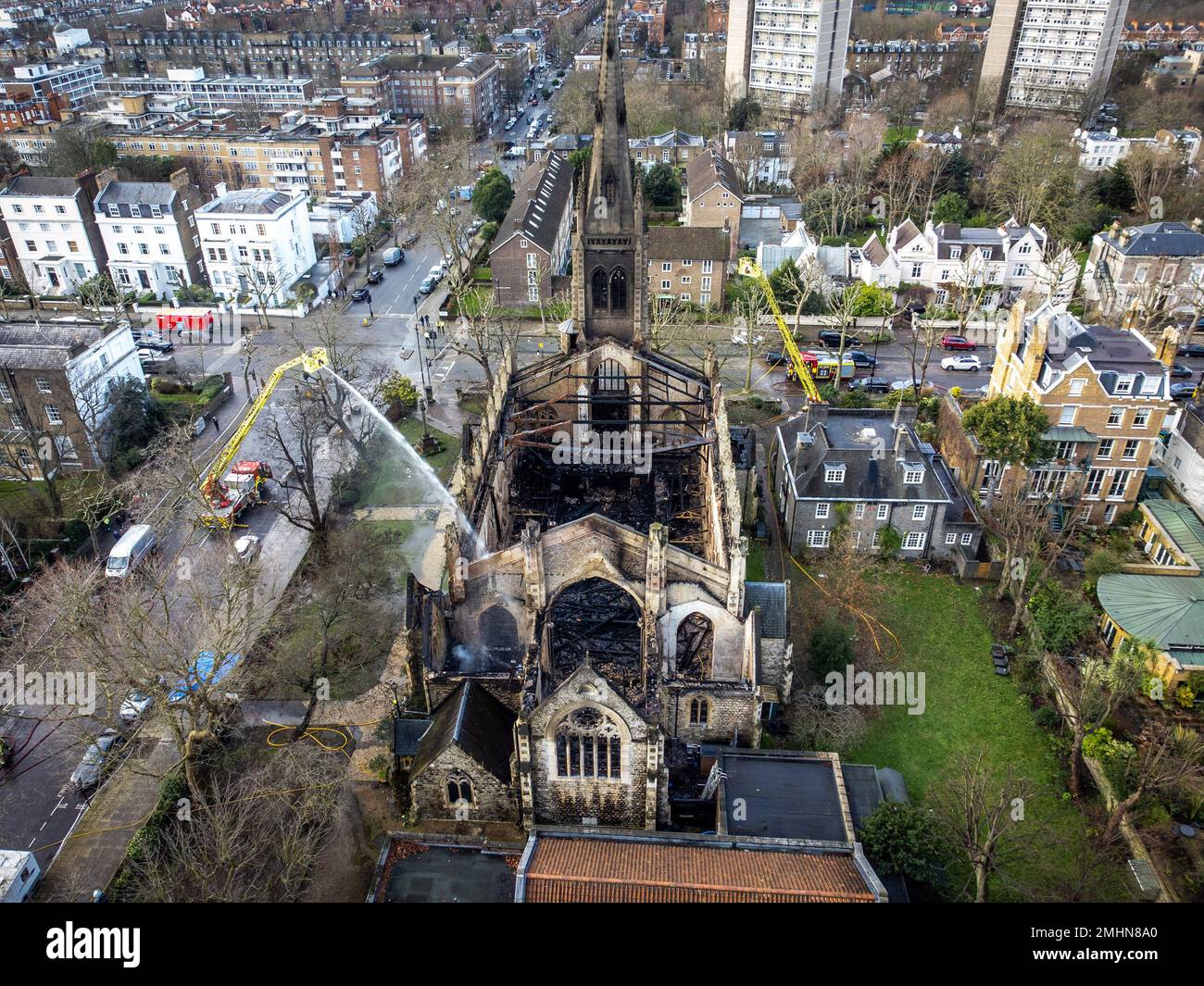 London, UK. Jan 27th 2023. Aerial view of burnt church as firefighters ...