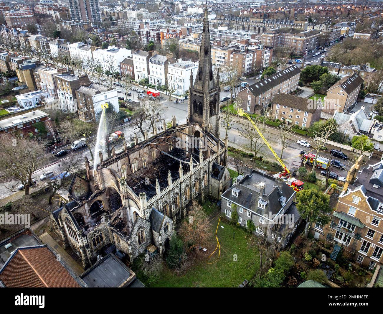 London, UK. Jan 27th 2023. Aerial view of burnt church as firefighters ...