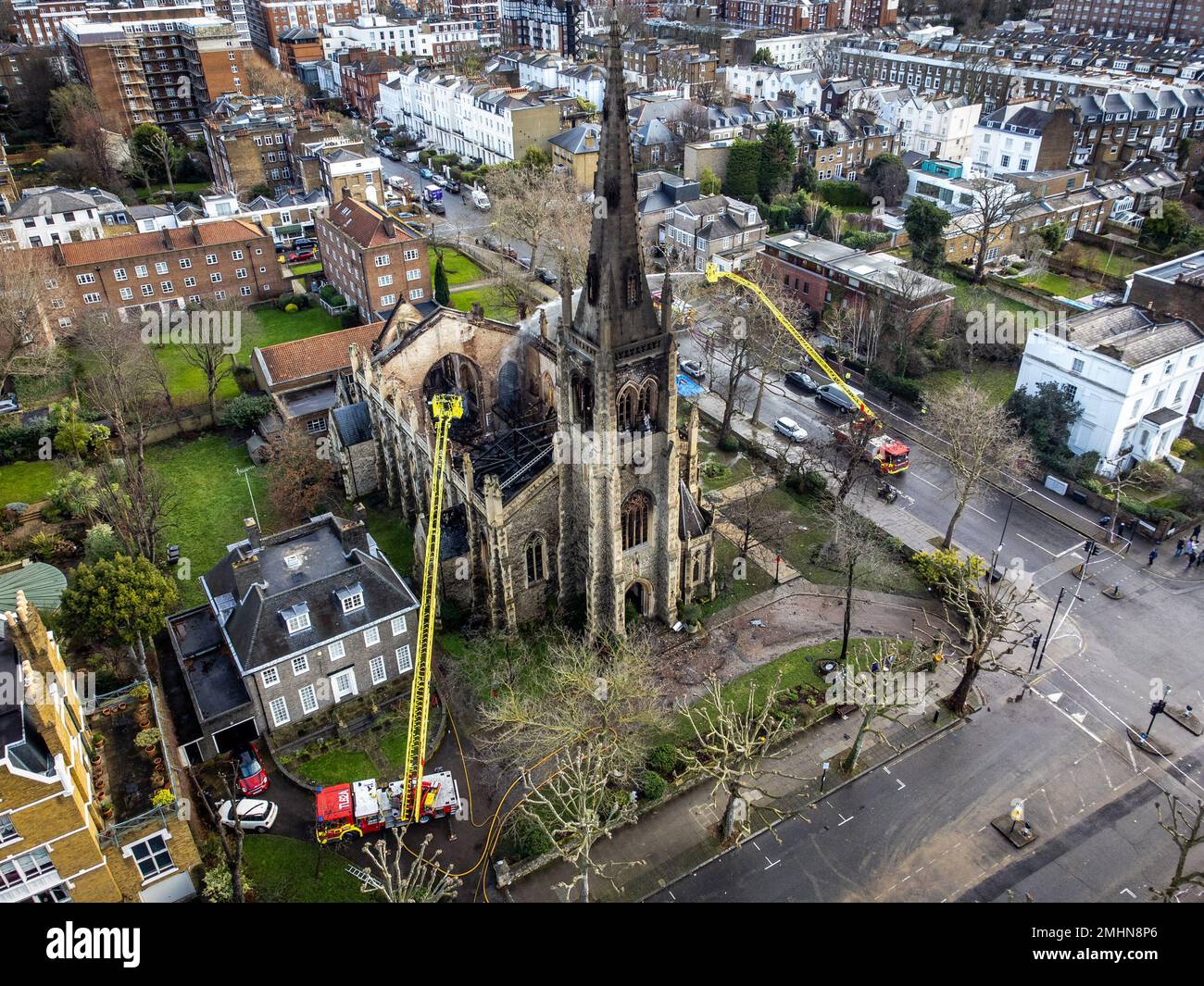 London, UK. Jan 27th 2023. Aerial view of burnt church as firefighters ...