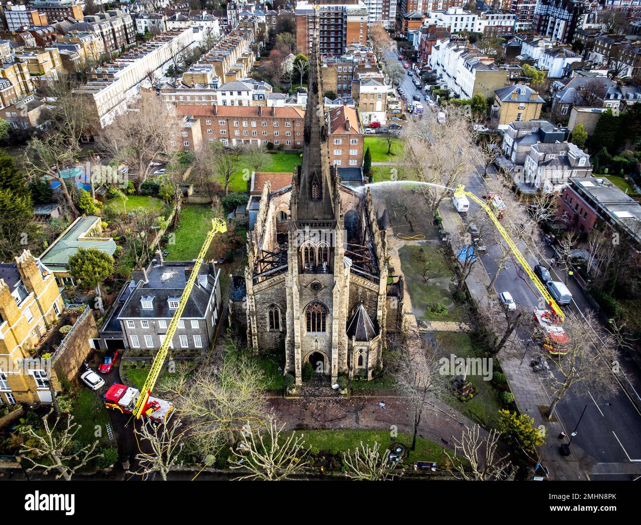 London, UK. Jan 27th 2023. Aerial view of burnt church as firefighters ...