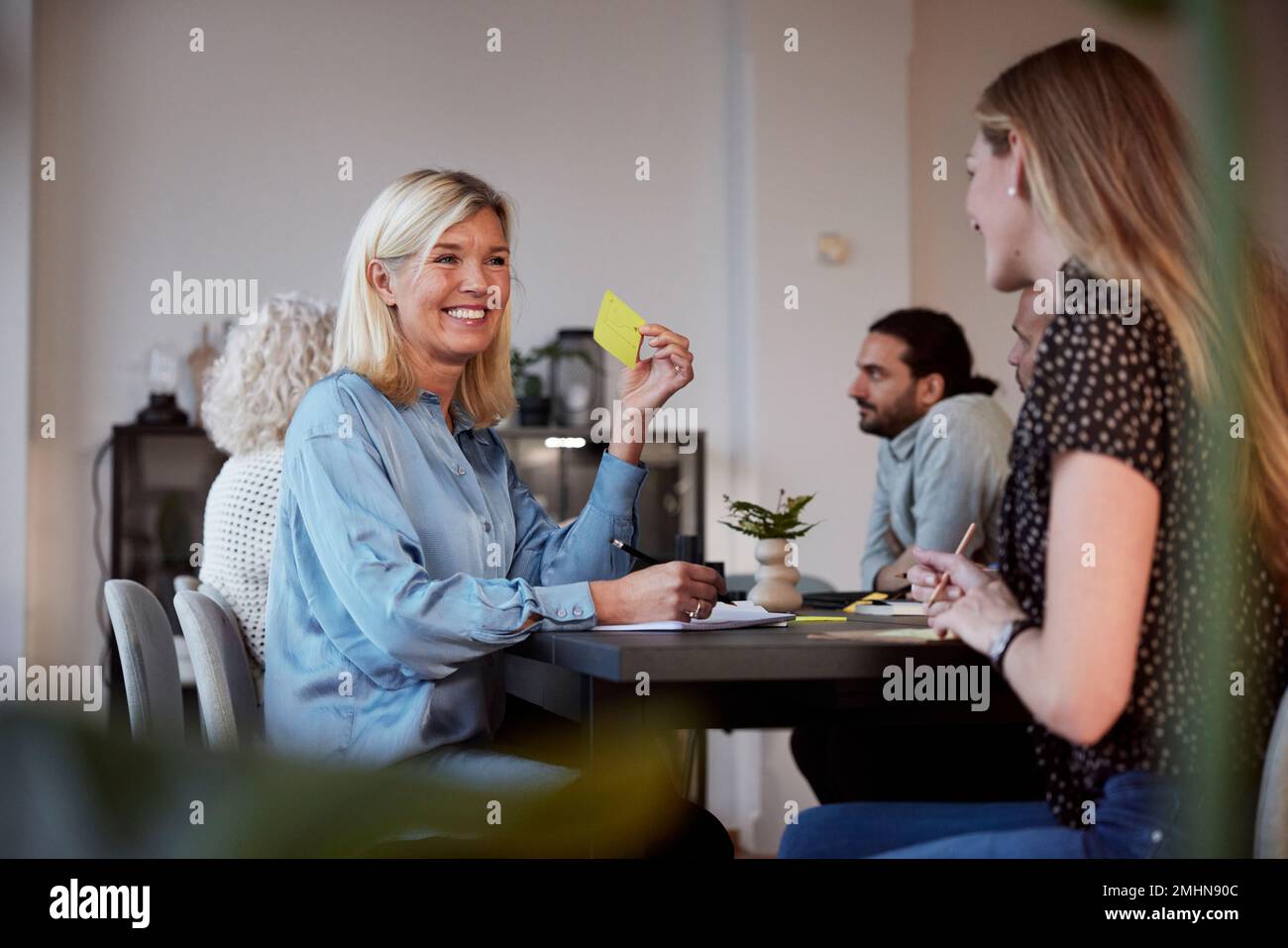 Smiling women during business meeting Stock Photo - Alamy