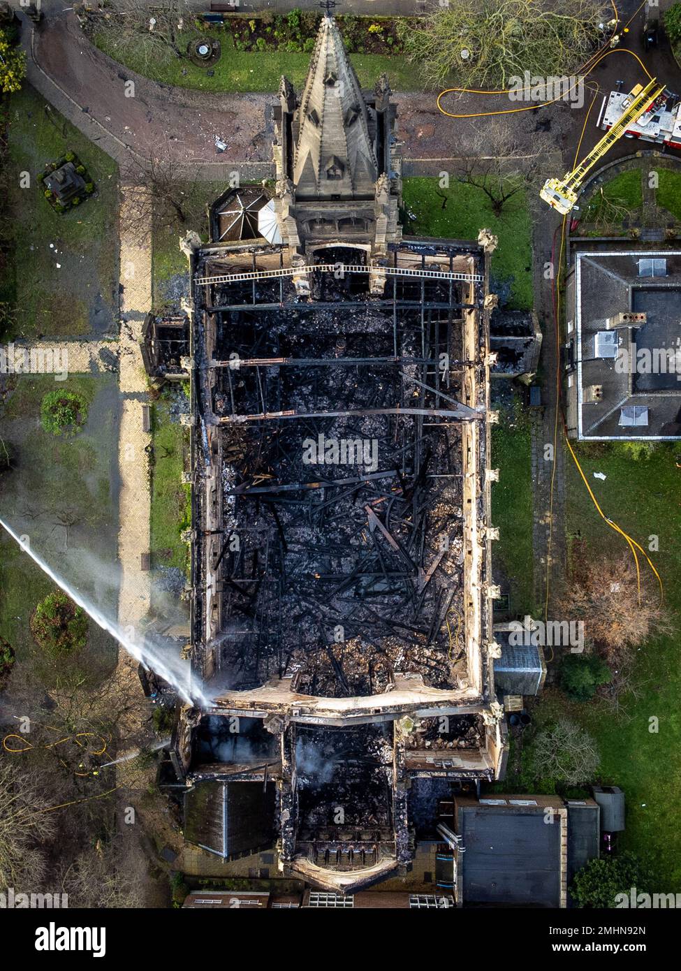 London, UK. Jan 27th 2023. Aerial view of burnt church as firefighters ...