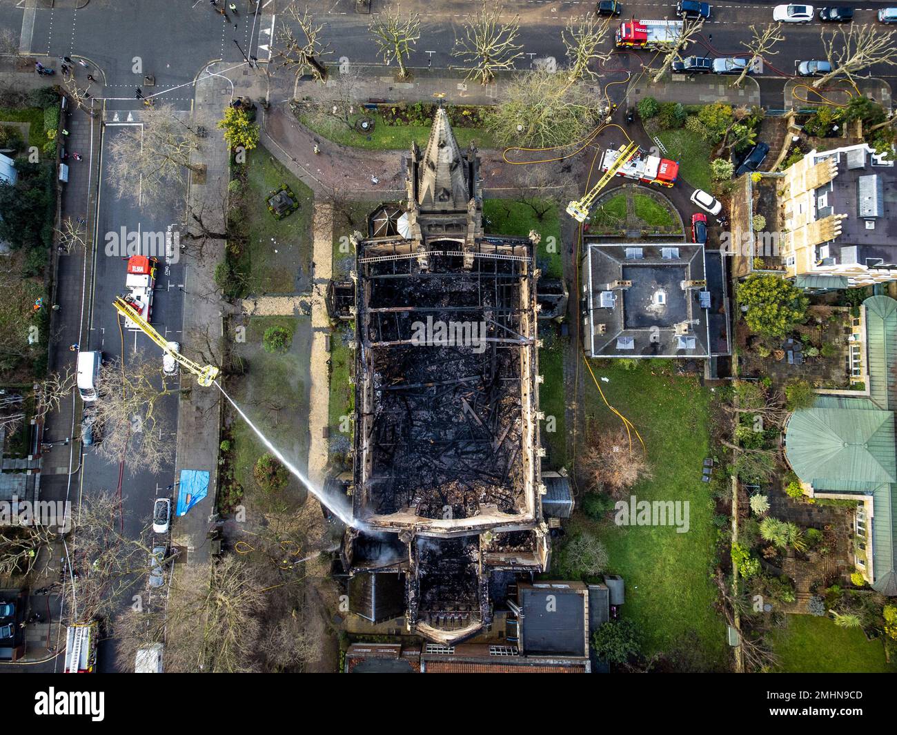 London, UK. Jan 27th 2023. Aerial view of burnt church as firefighters ...