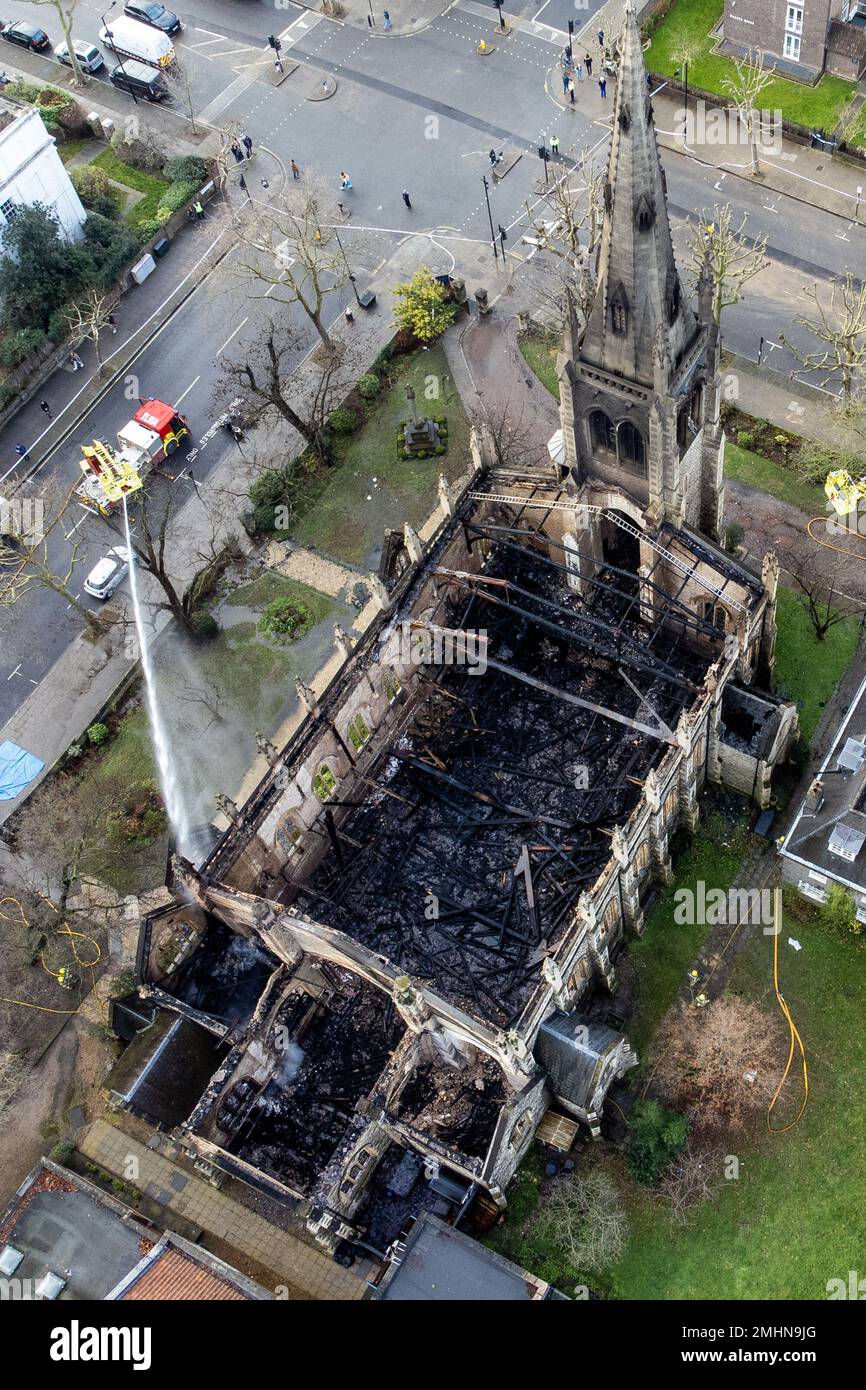 London, UK. Jan 27th 2023. Aerial view of burnt church as firefighters ...