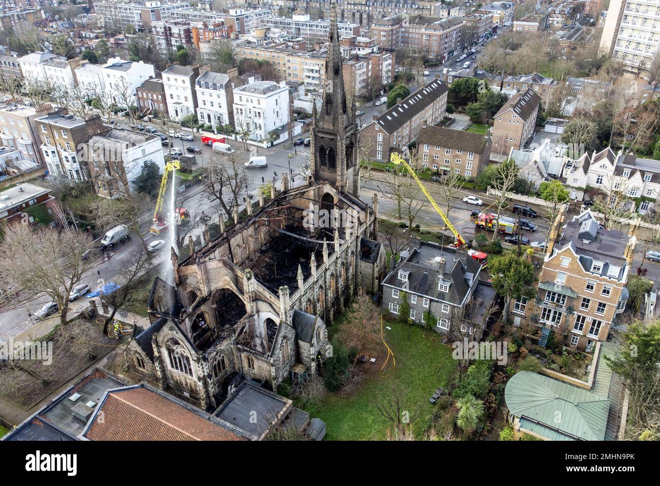 London, UK. Jan 27th 2023. Aerial view of burnt church as firefighters ...