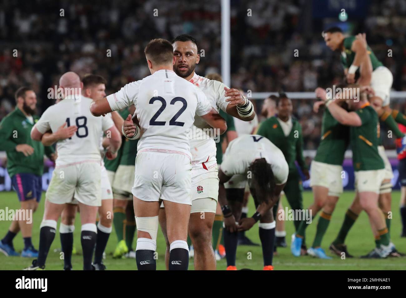 England's Billy Vunipola, center right, and Henry Slade (22) react ...