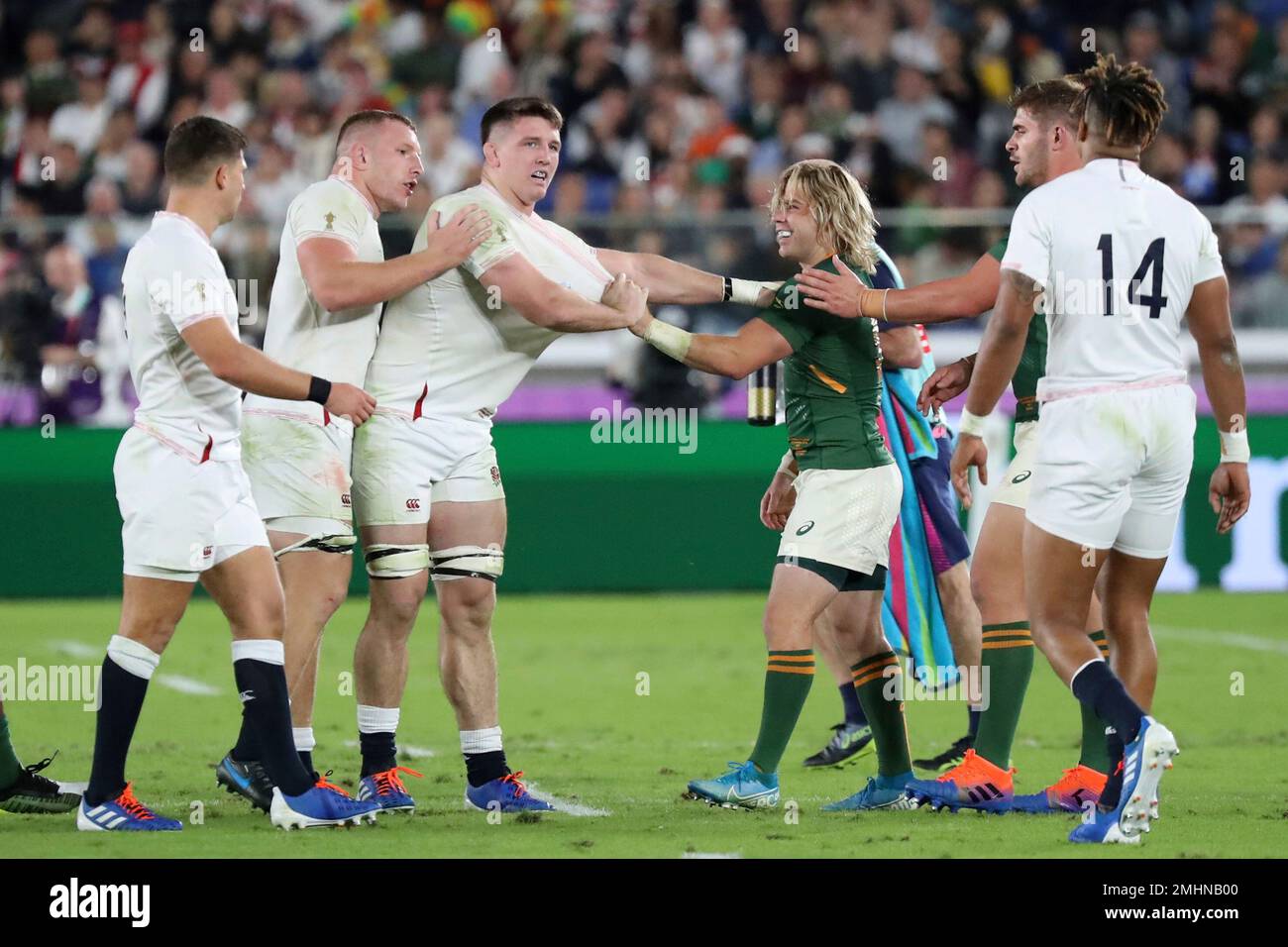 South Africa's Faf de Klerk, center right, and England's Tom Curry ...