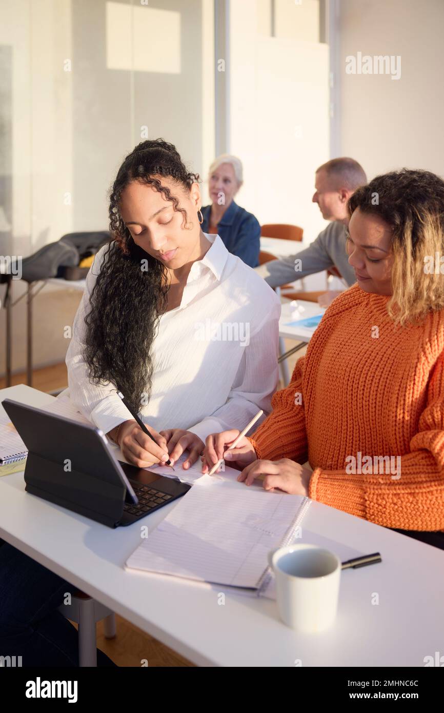 Women working together at workshop Stock Photo - Alamy
