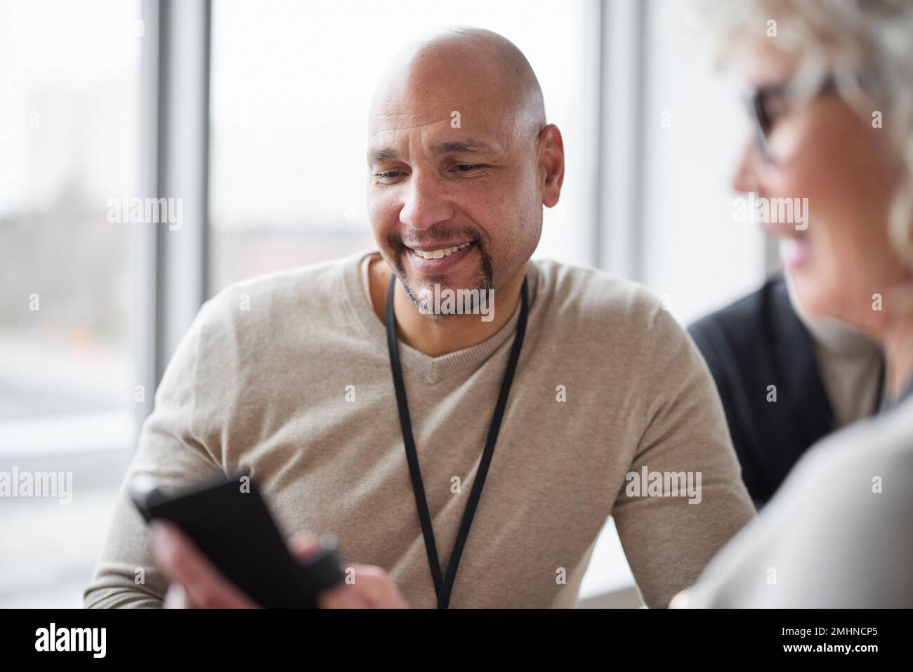 Smiling man looking away Stock Photo - Alamy