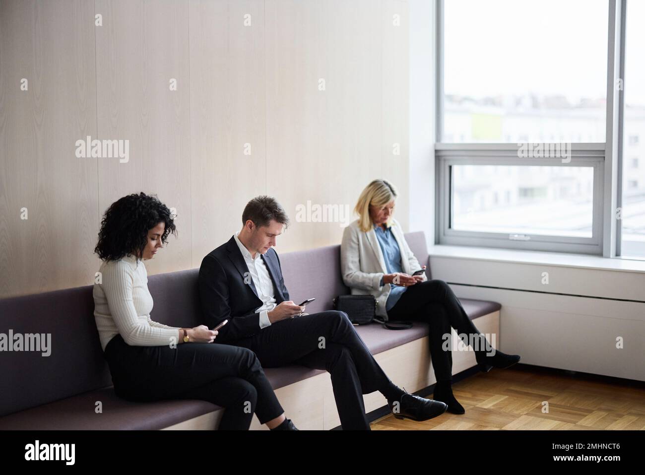 Business people using cell phones Stock Photo - Alamy