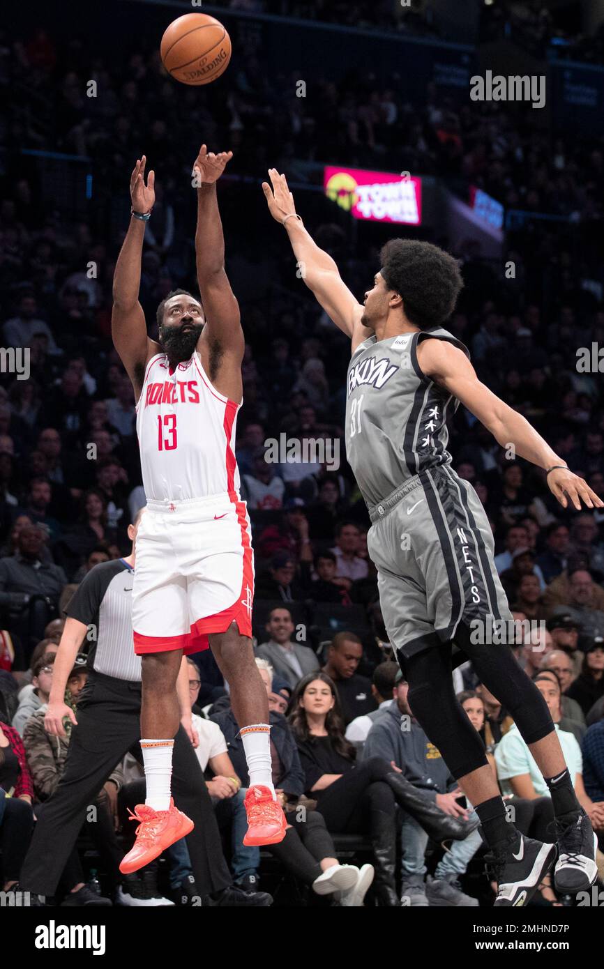 Houston Rockets guard James Harden (13) shoots a 3-pointer past ...