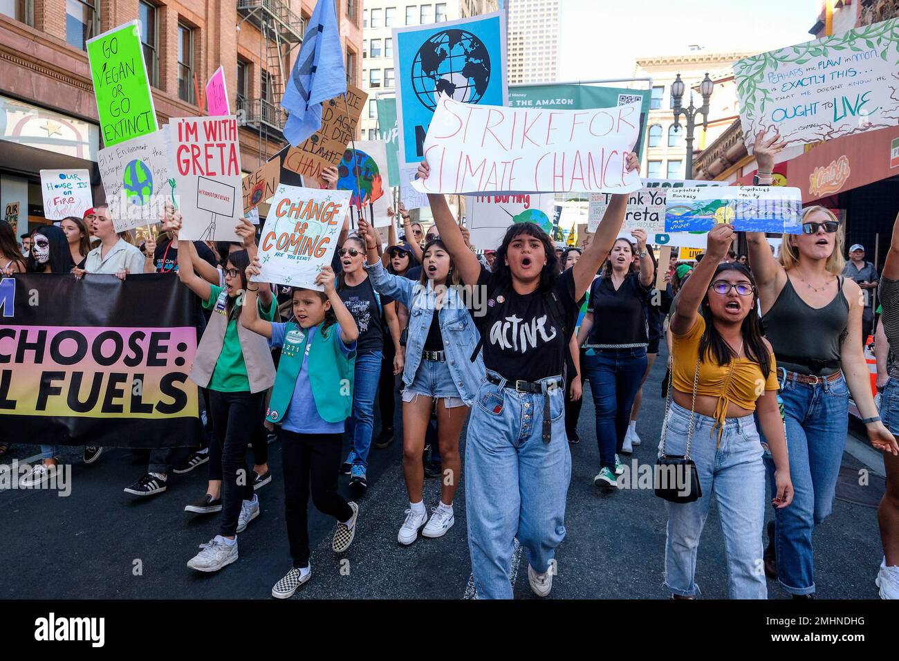 Climate activists participate in a student-led climate change march in ...