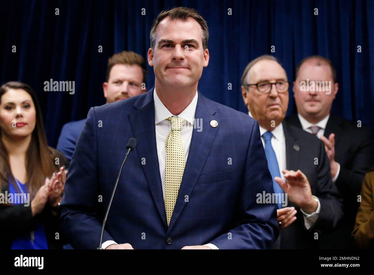 Oklahoma Gov. Kevin Stitt is applauded after speaking at a news ...