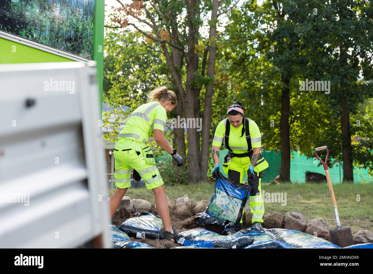 Female workers doing landscaping work Stock Photo - Alamy