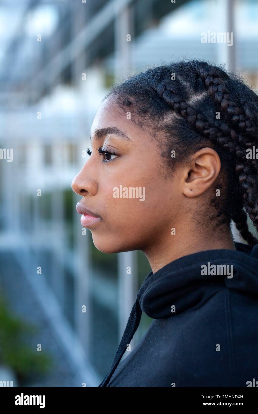 Profile of beautiful woman with braided hair Stock Photo - Alamy