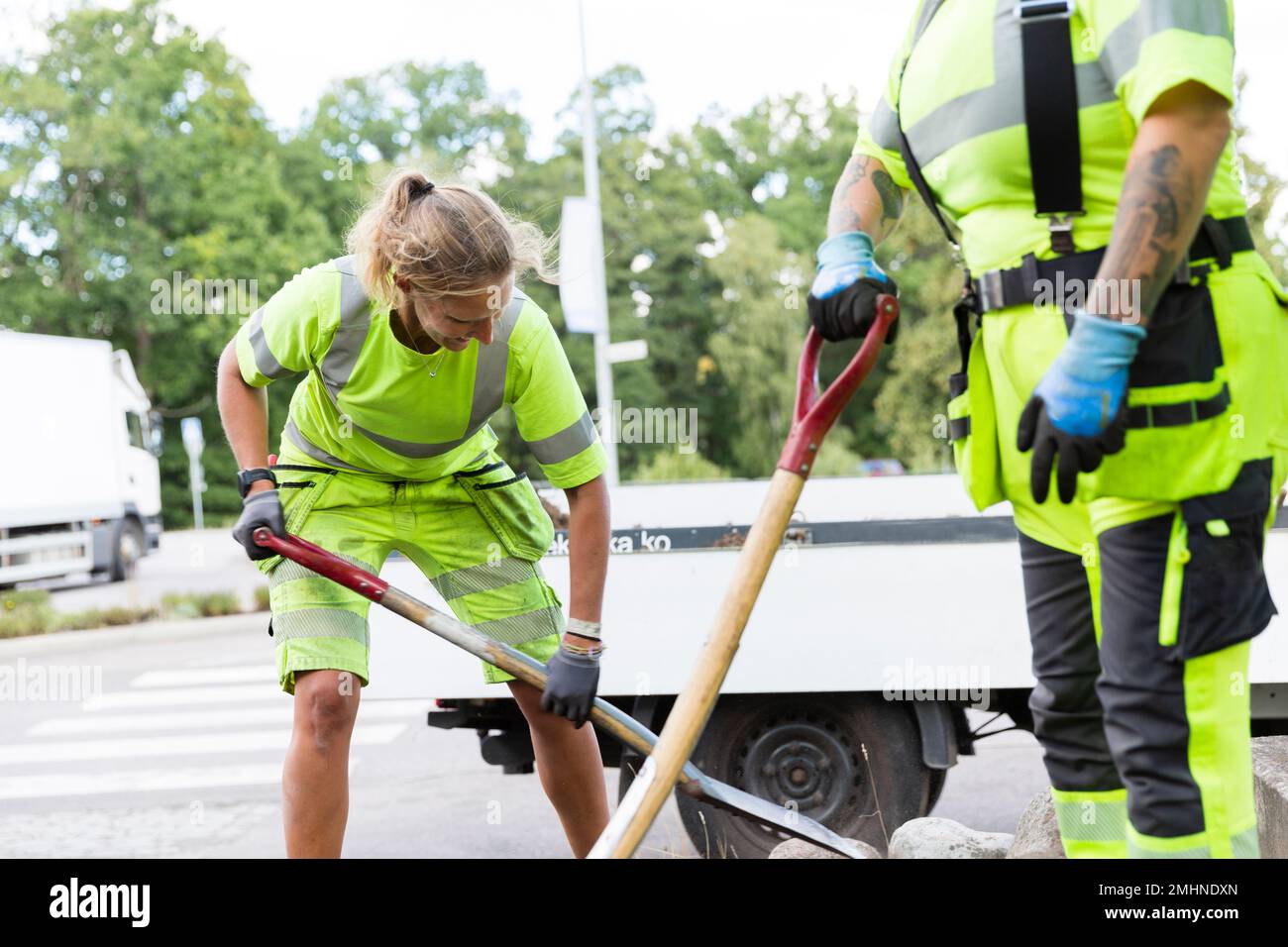 Female workers doing landscaping work Stock Photo - Alamy