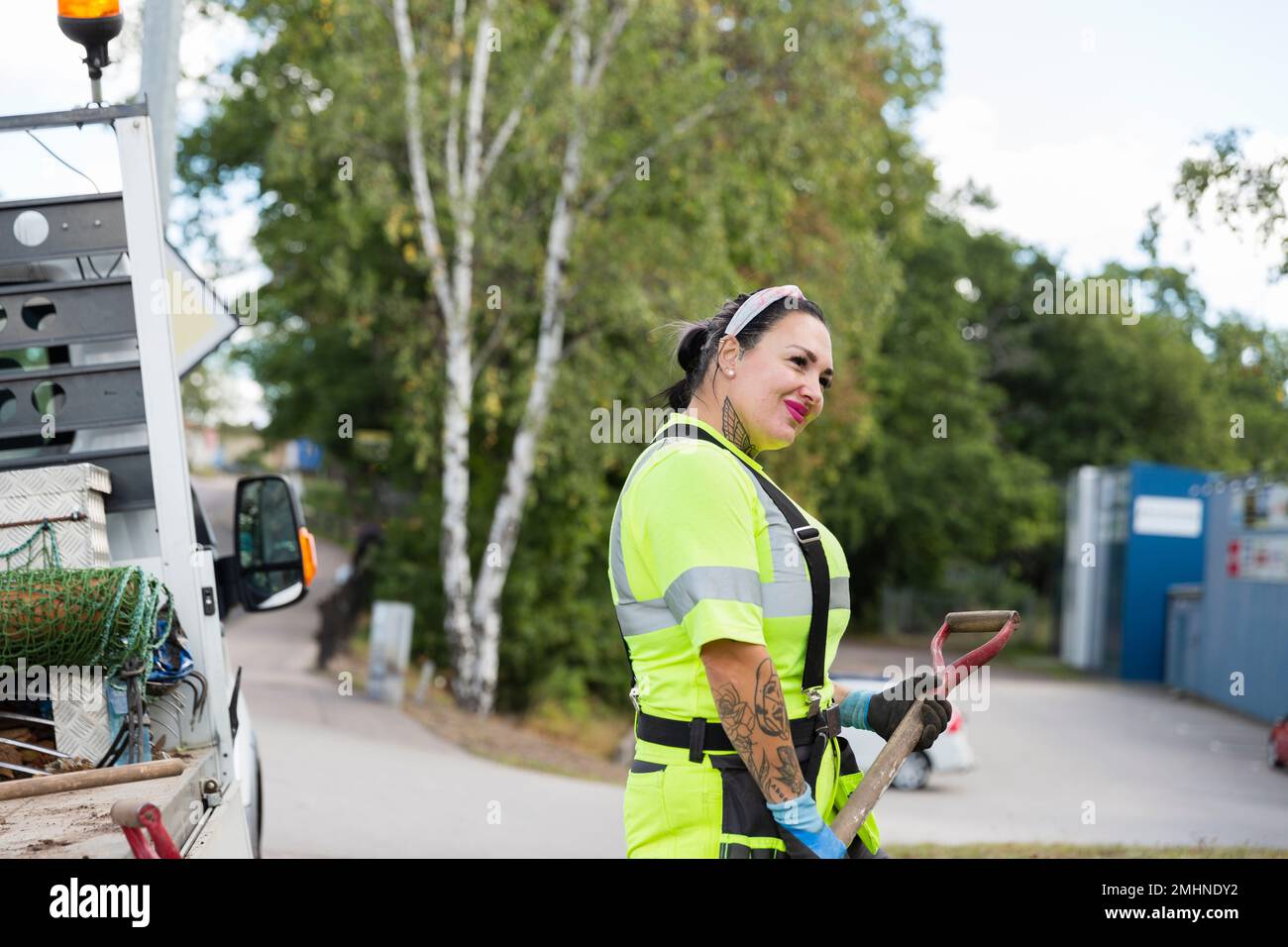 Female worker doing landscaping work Stock Photo - Alamy