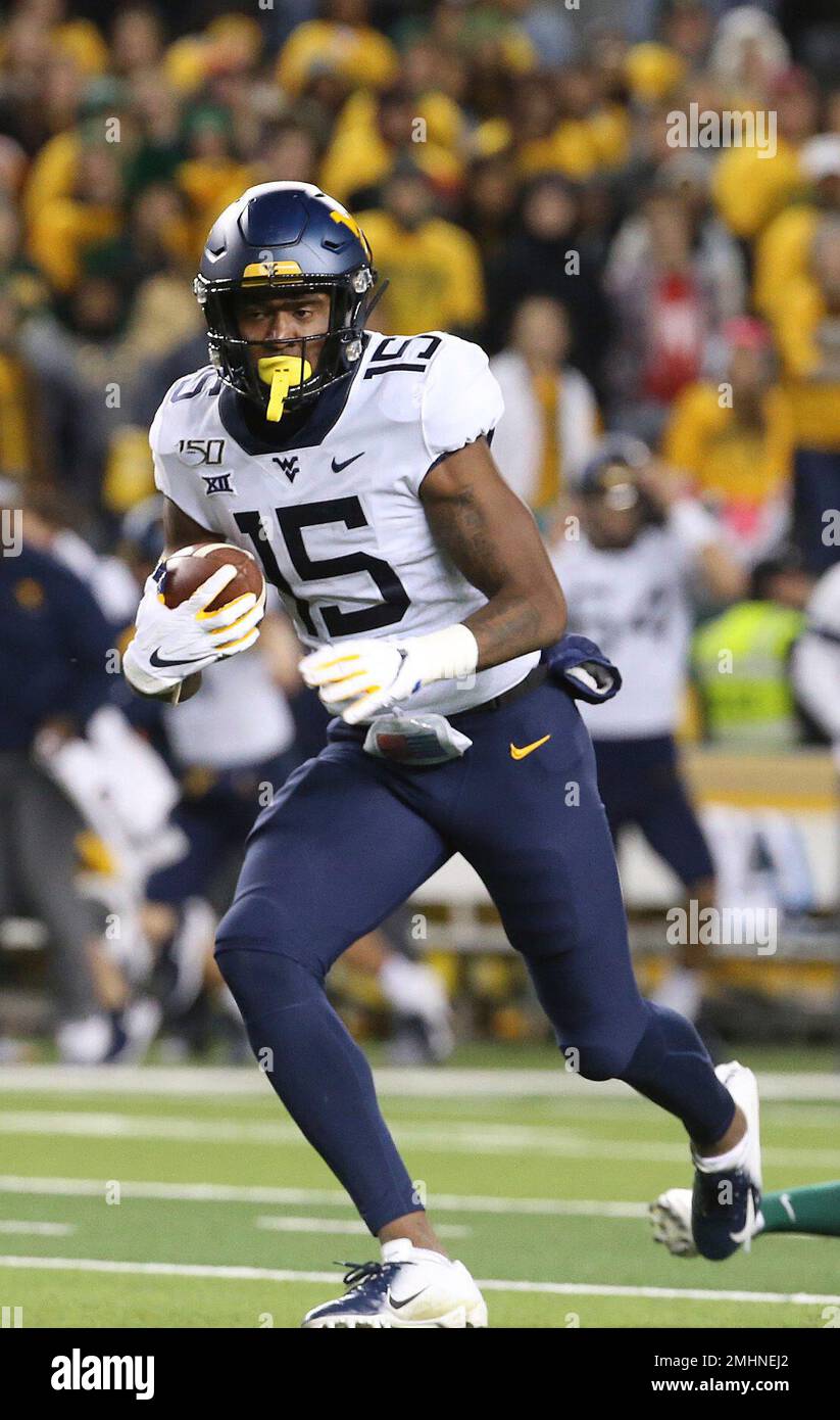 West Virginia wide receiver George Campbell (15) runs after the catch ...