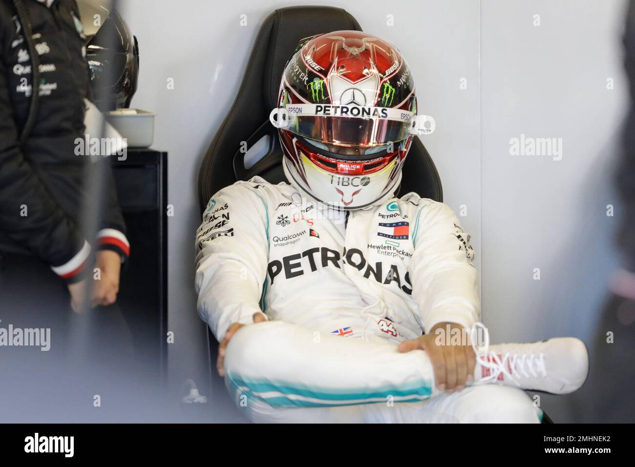 Mercedes driver Lewis Hamilton, of Britain, sits in his garage during ...