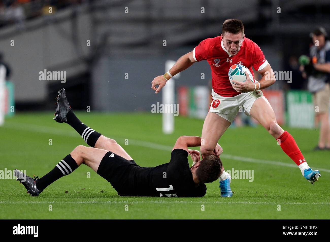 Wales' Josh Adams, right, evades New Zealand's Beauden Barrett during ...