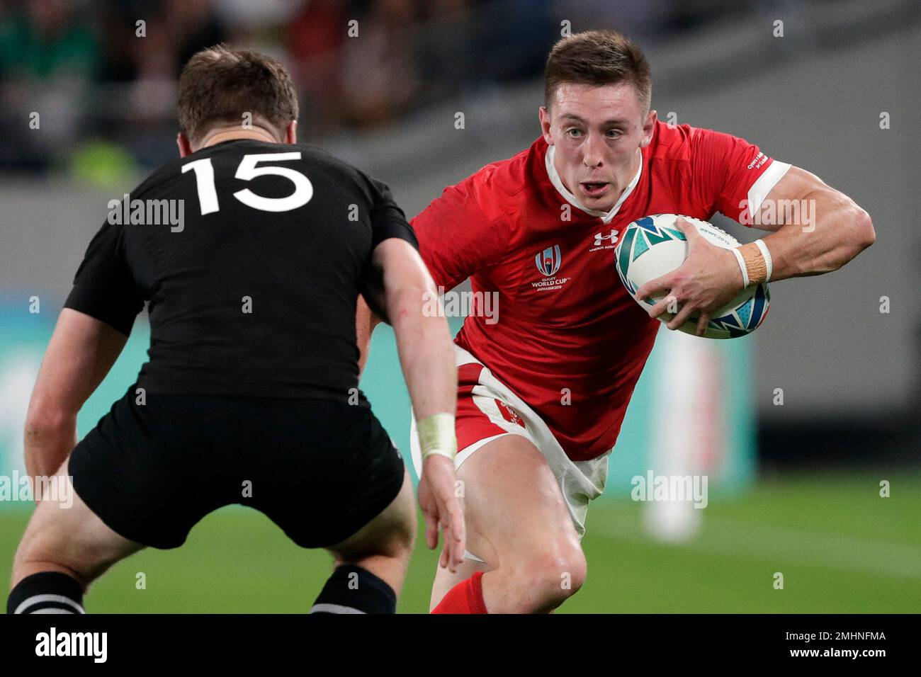 Wales' Josh Adams, right, evades New Zealand's Beauden Barrett during ...