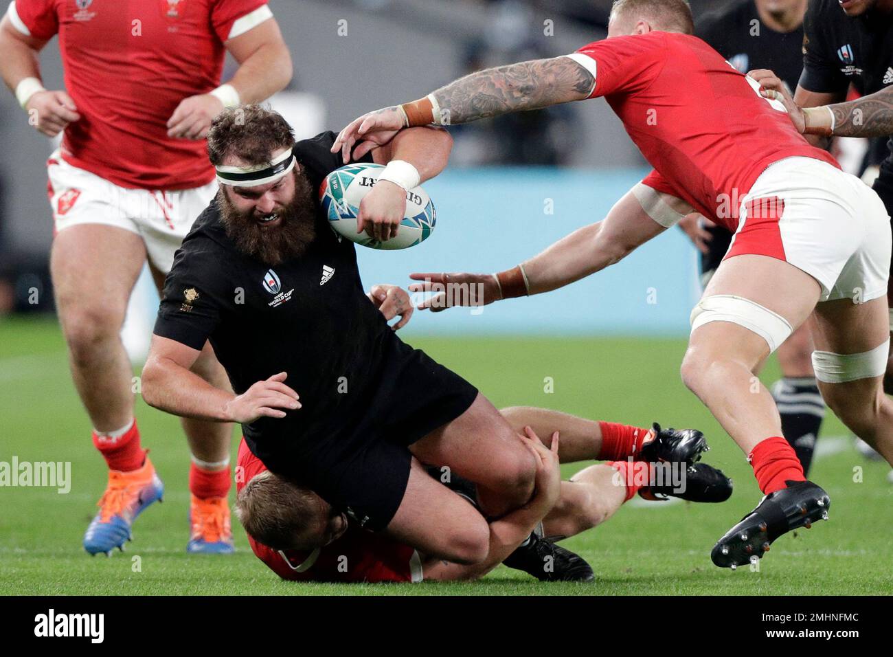 New Zealand's Liam Coltman is tackled during the Rugby World Cup bronze ...
