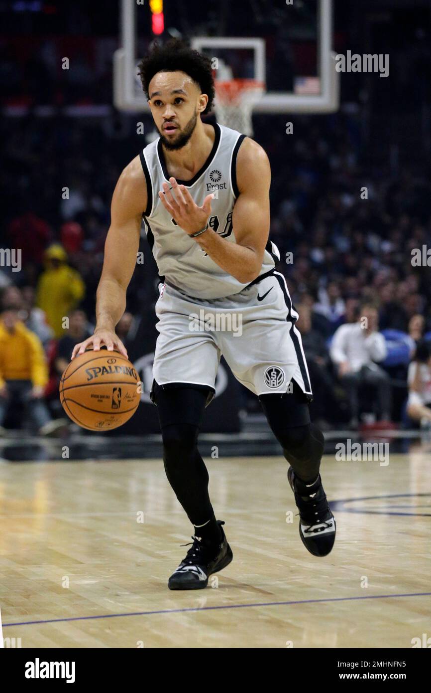 San Antonio Spurs guard Derrick White dribbles during the first half of ...