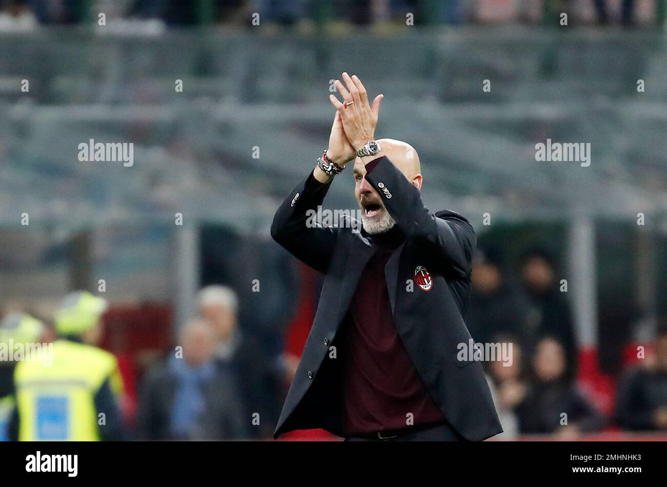AC Milan's manager Stefano Pioli waves at the end of the Serie A soccer ...