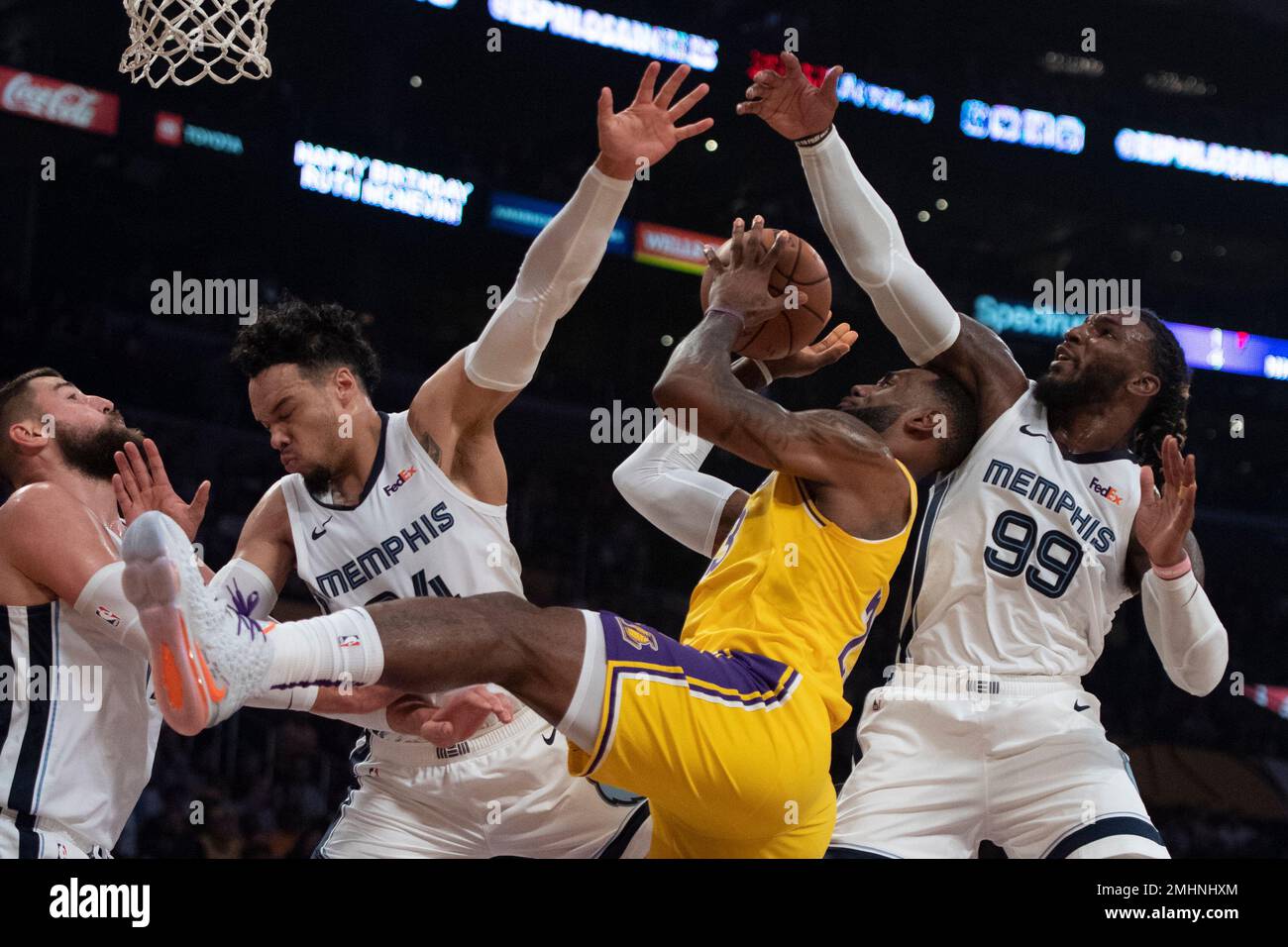 Los Angeles Lakers forward LeBron James, center, shoots under pressure ...