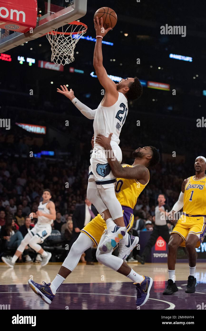 Memphis Grizzlies guard Tyus Jones, top, shoots over Los Angeles Lakers ...