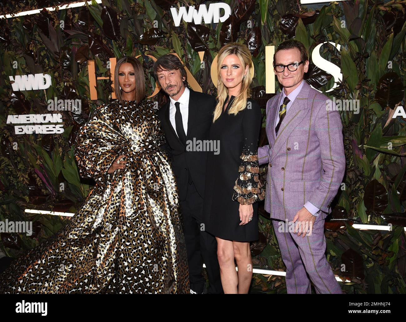 Model Iman, left, honoree Pierpaolo Piccioli, socialite Nicky Hilton ...
