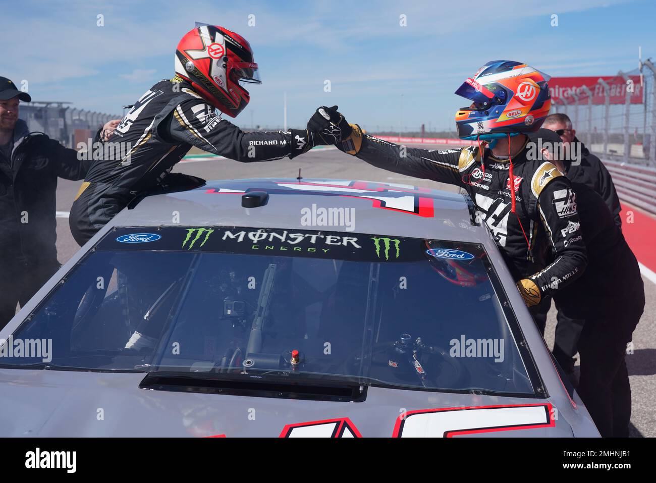 Haas drivers Kevin Magnussen, of Denmark, and Romain Grosjean, right ...