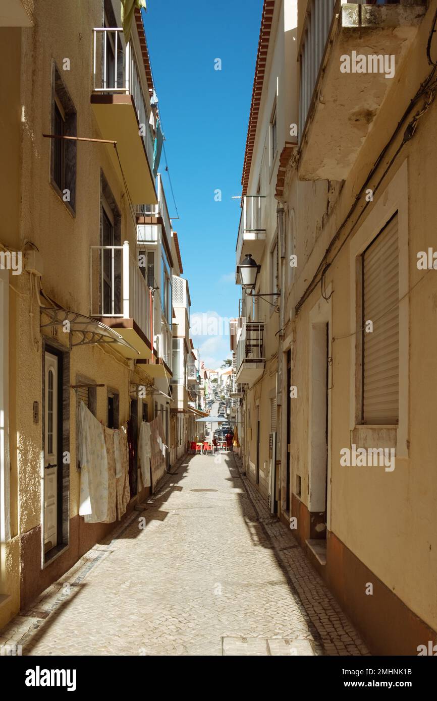 View of a narrow street in Nazare, Portugal Stock Photo - Alamy