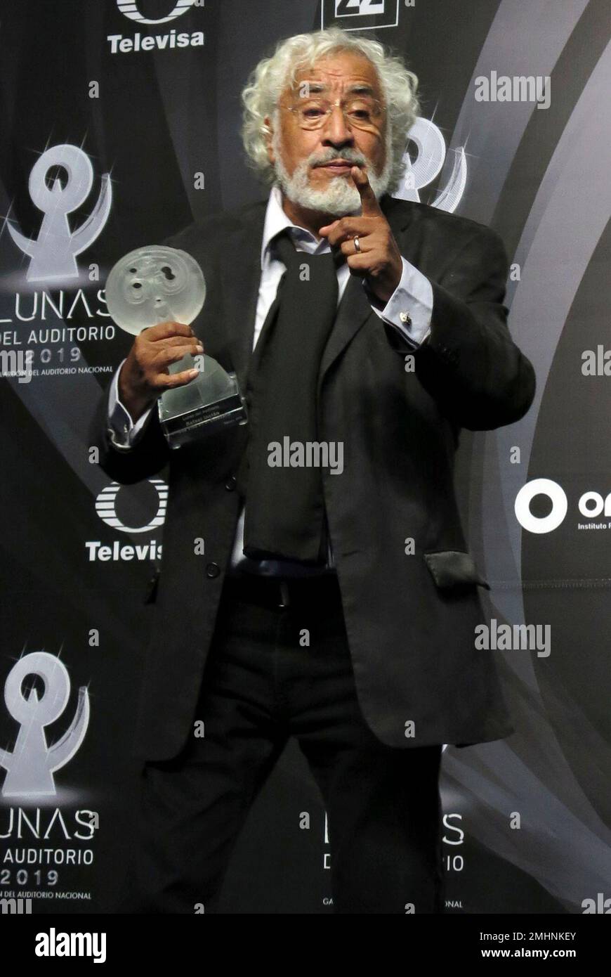 Mexican actor Rafael Inclan poses with his Lifetime Achievement prize ...