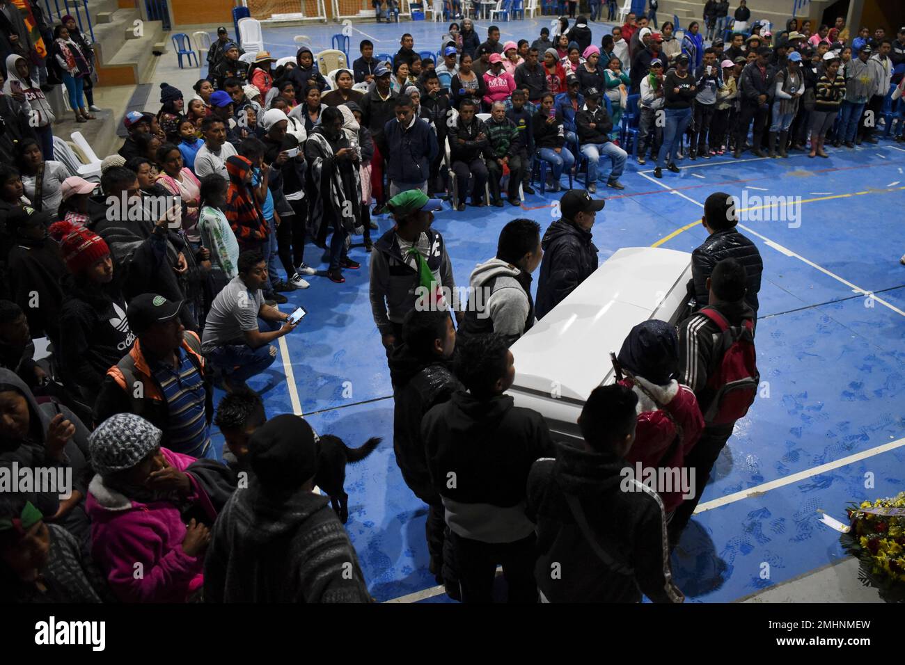 Indigenous men carry the coffin of a slain leader during a wake in ...