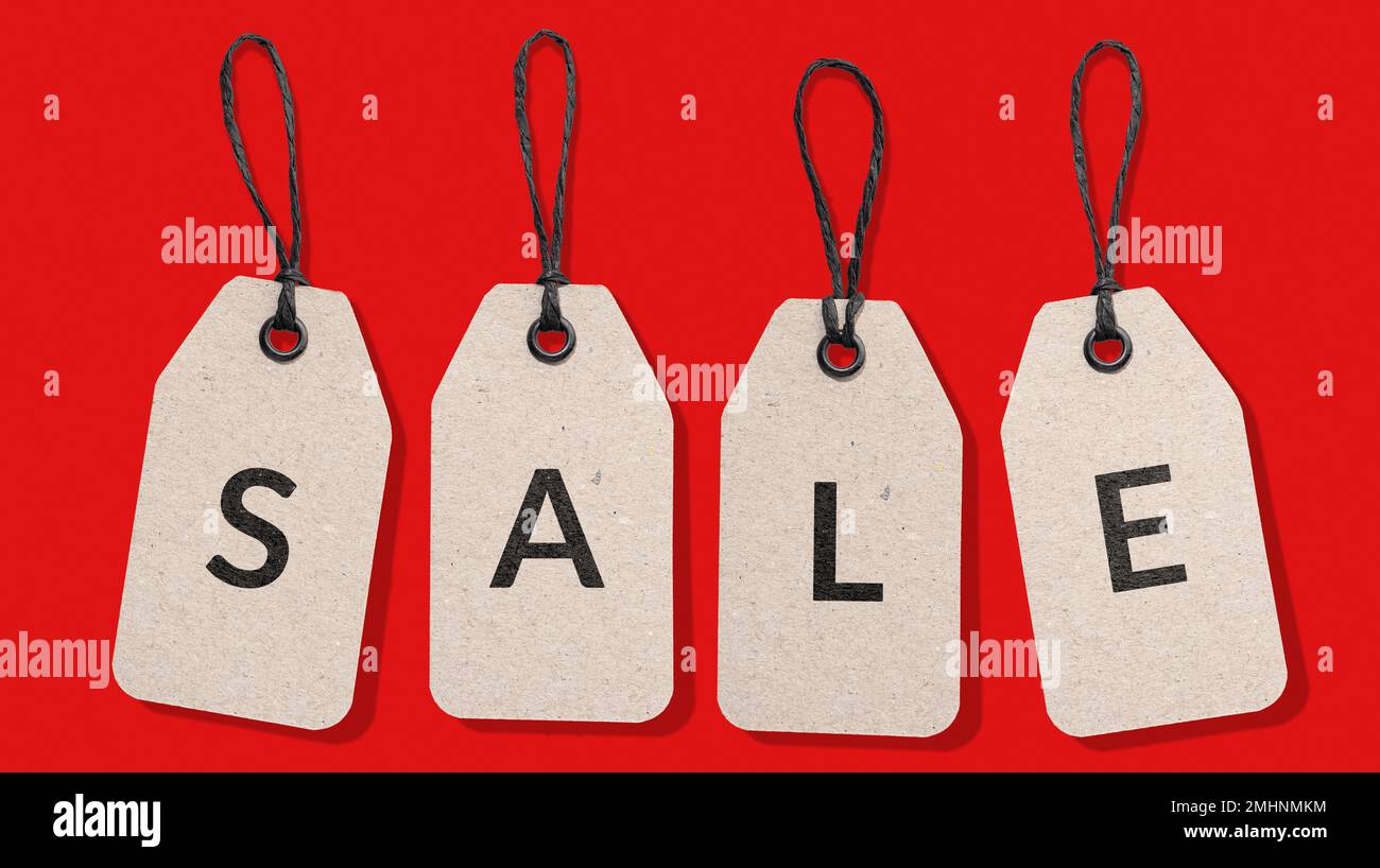 SALE word on cardboard price tag set isolated on red background. Sale ...