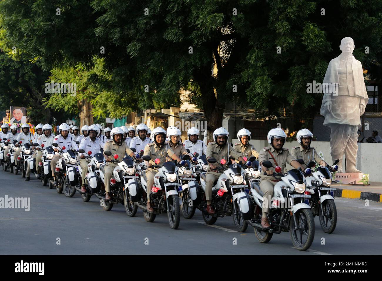 Indian policemen ride past a statue of Sardar Patel as they participate ...