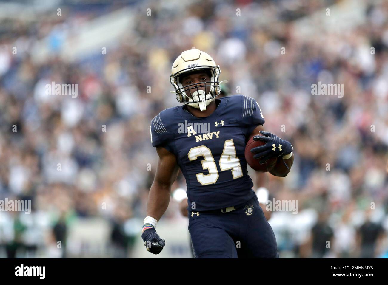 Navy fullback Jamale Carothers runs for a score against Tulane during ...
