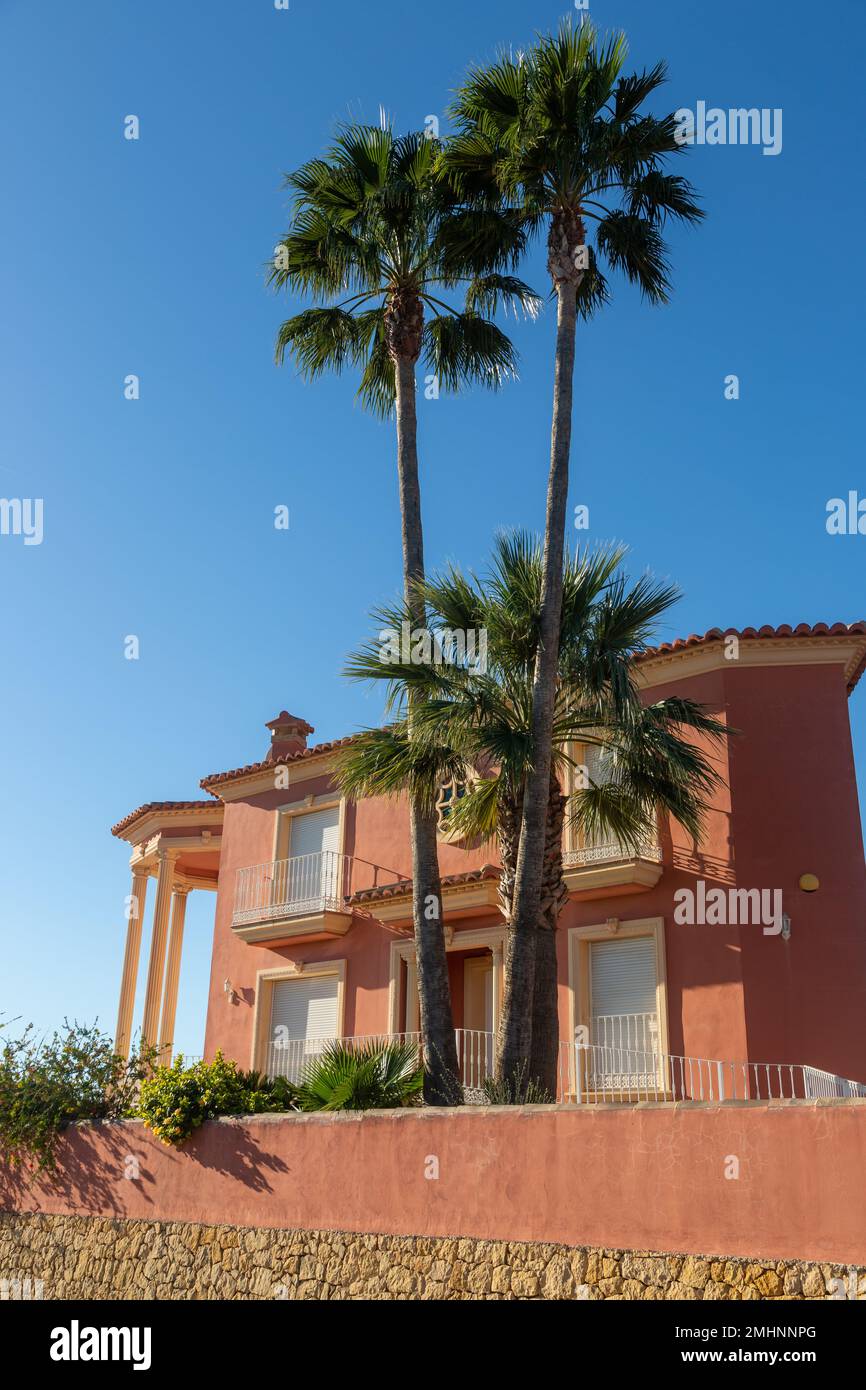 A spanish house near Calpe with large palm trees in the garden Stock ...